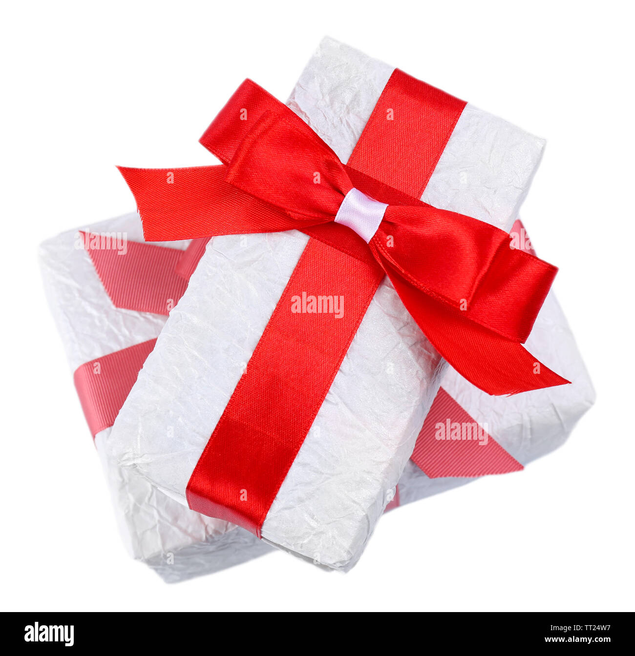 Beautiful gifts with red ribbons, isolated on white Stock Photo - Alamy