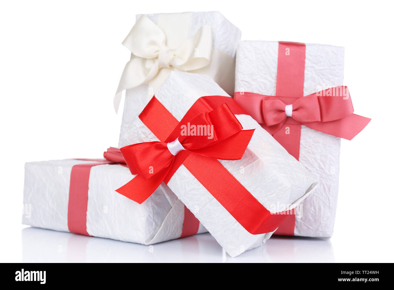 Beautiful gifts with red ribbons, isolated on white Stock Photo - Alamy