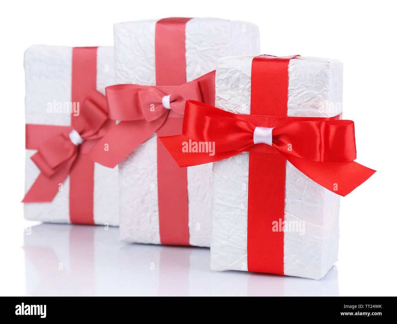 Beautiful gifts with red ribbons, isolated on white Stock Photo - Alamy