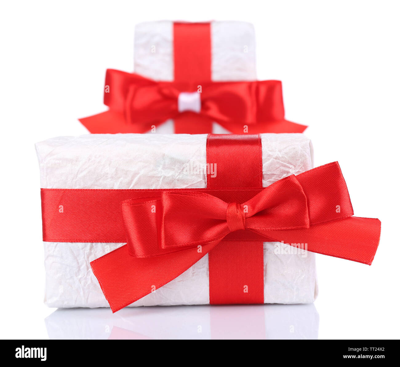 Beautiful gifts with red ribbons, isolated on white Stock Photo - Alamy