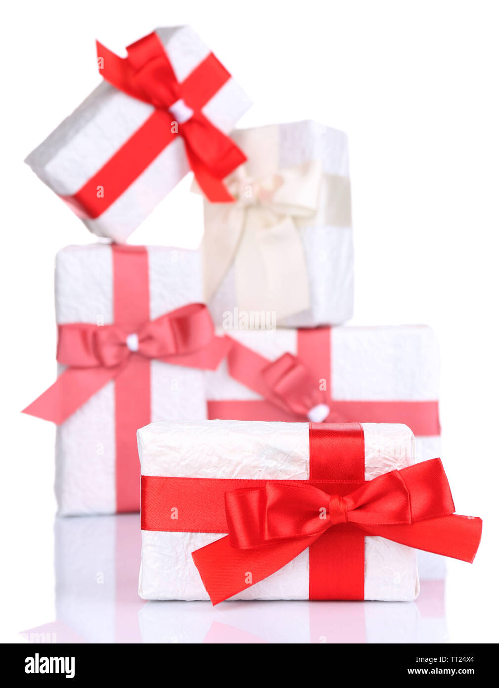 Beautiful gifts with red ribbons, isolated on white Stock Photo - Alamy