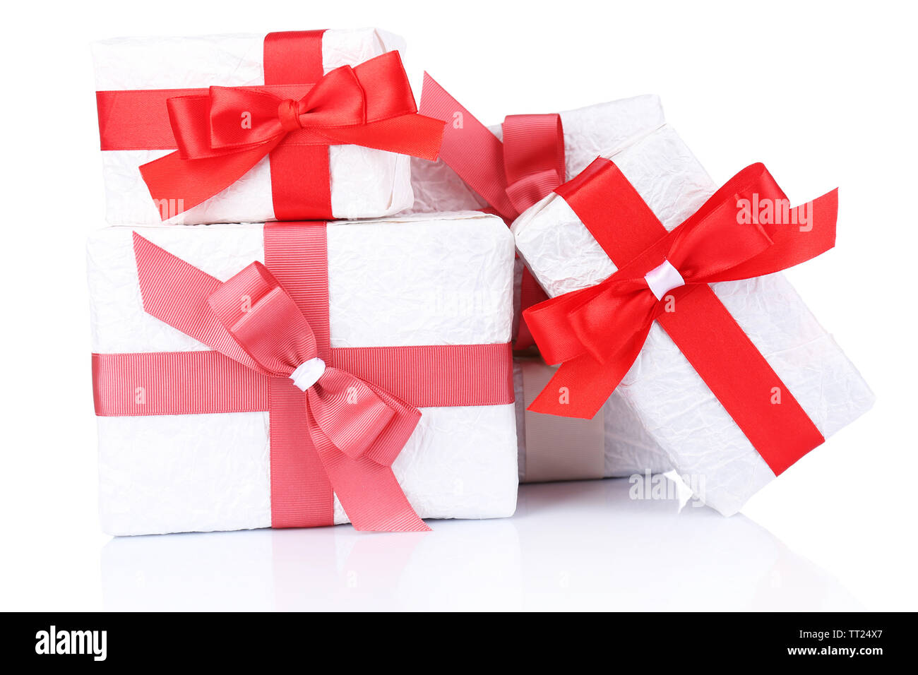 Beautiful gifts with red ribbons, isolated on white Stock Photo - Alamy