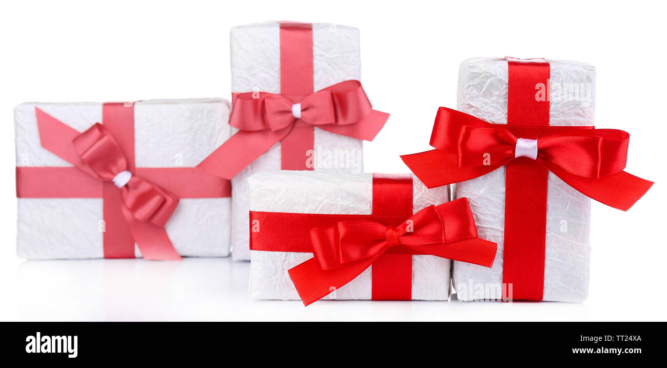 Beautiful gifts with red ribbons, isolated on white Stock Photo - Alamy