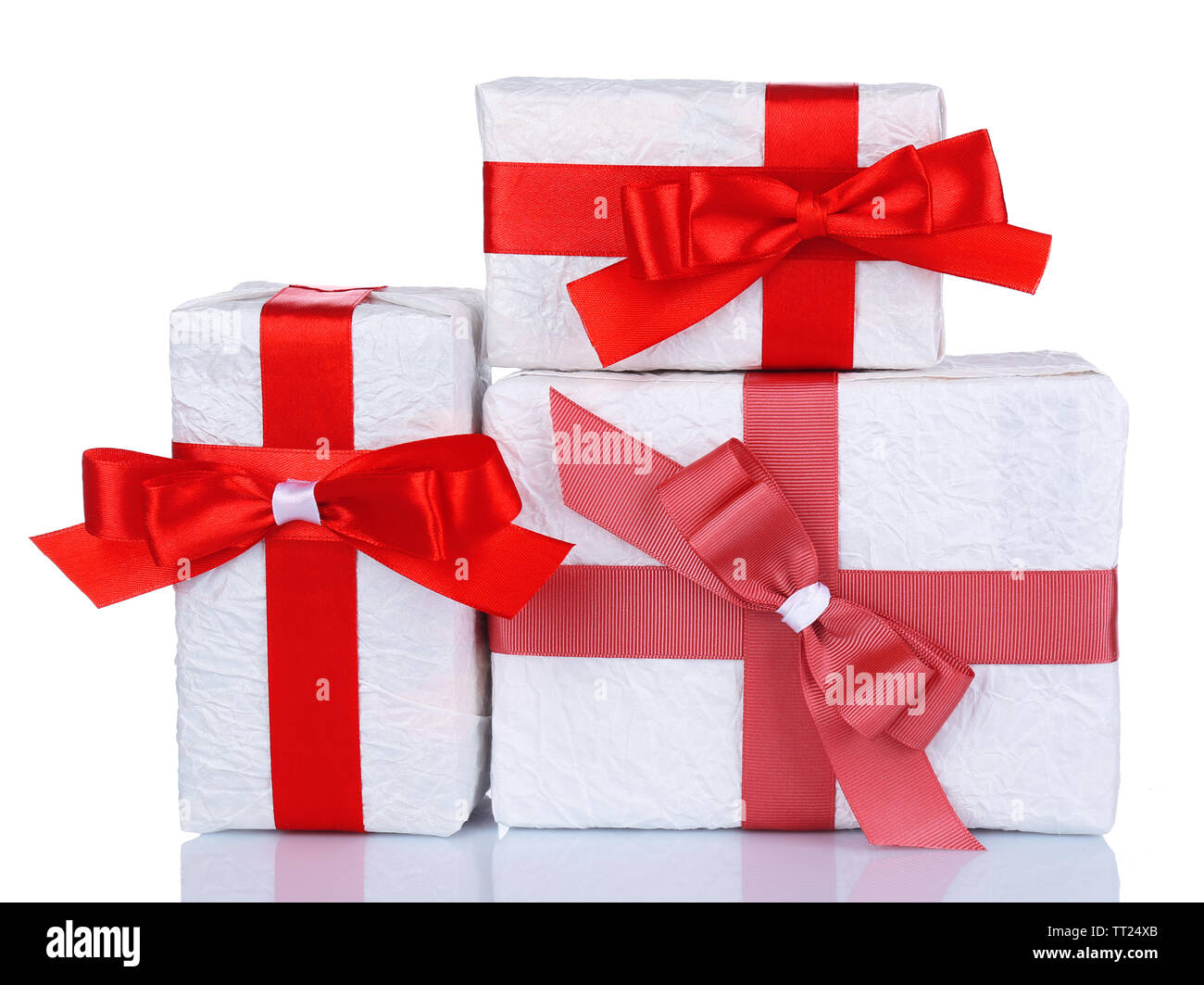 Beautiful gifts with red ribbons, isolated on white Stock Photo - Alamy