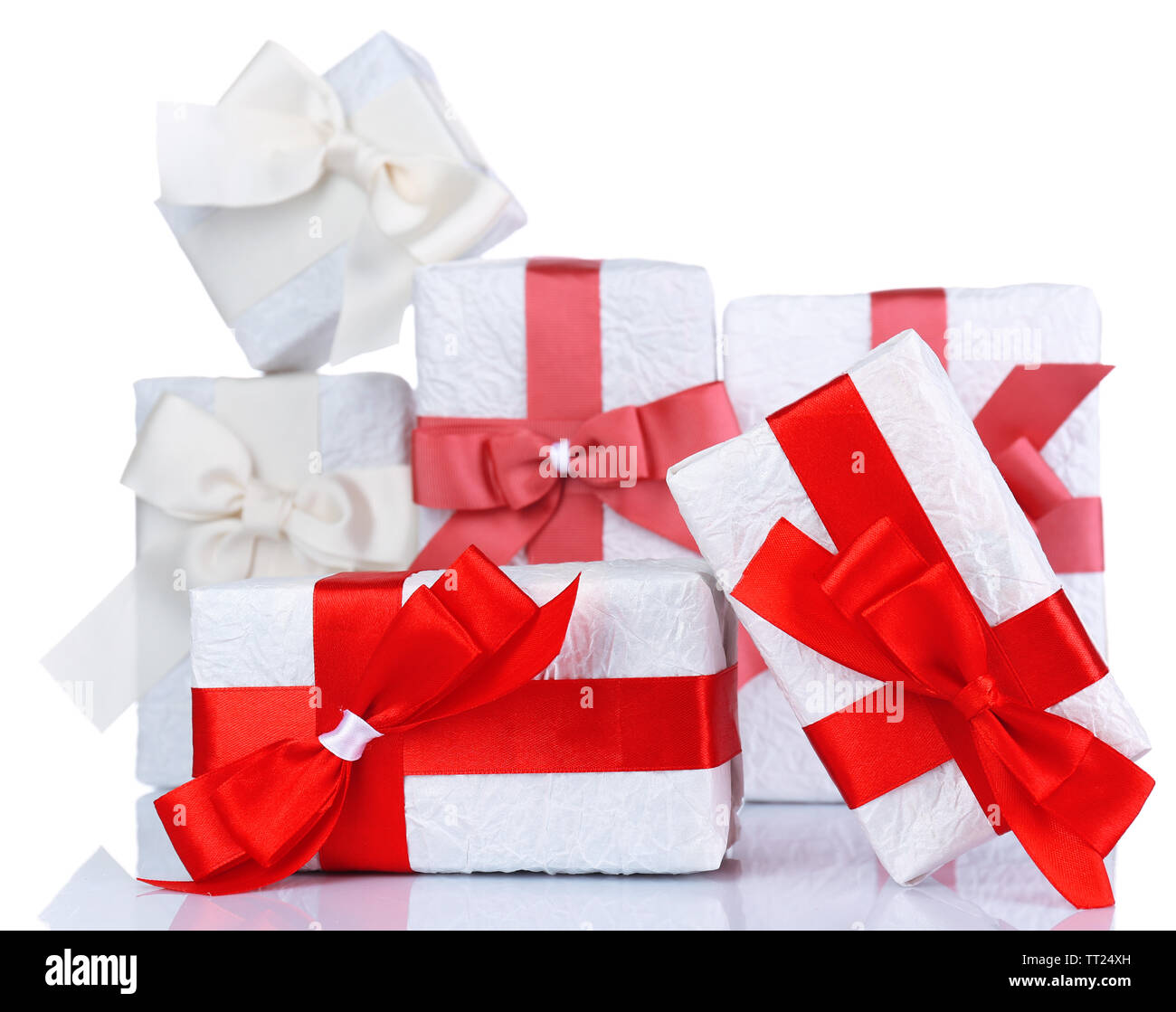 Beautiful gifts with red ribbons, isolated on white Stock Photo - Alamy