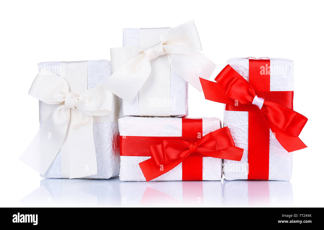 Beautiful gifts with red ribbons, isolated on white Stock Photo - Alamy