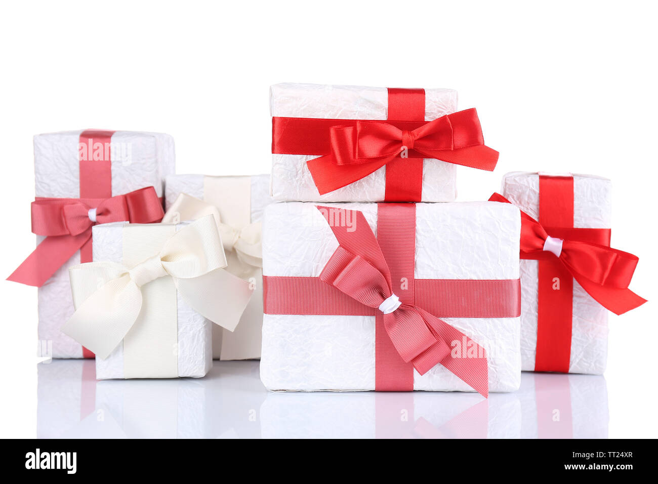 Beautiful gifts with red ribbons, isolated on white Stock Photo - Alamy
