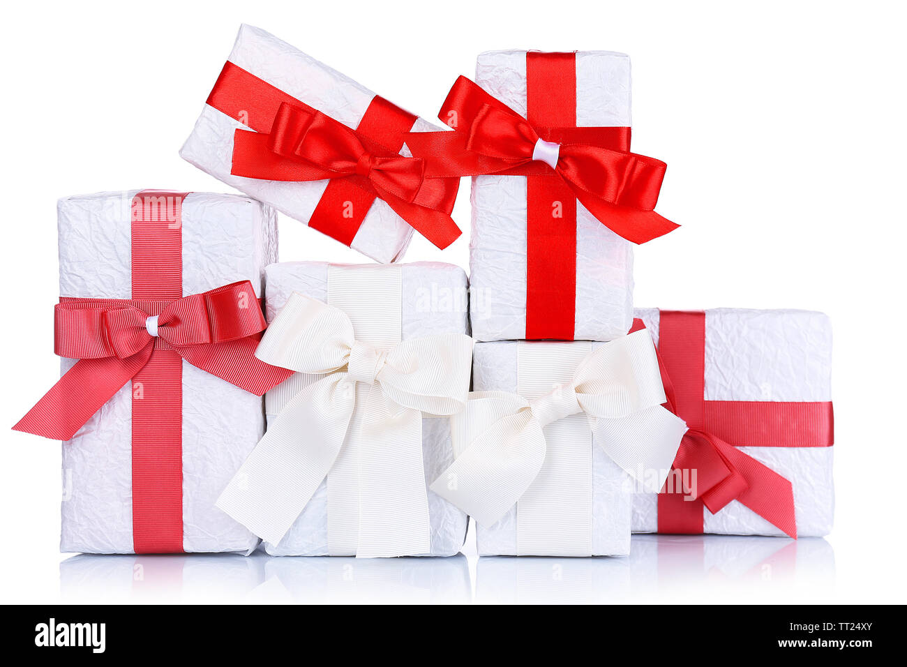 Beautiful gifts with red ribbons, isolated on white Stock Photo - Alamy