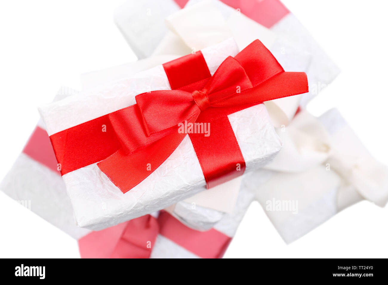 Beautiful gifts with red ribbons, isolated on white Stock Photo - Alamy