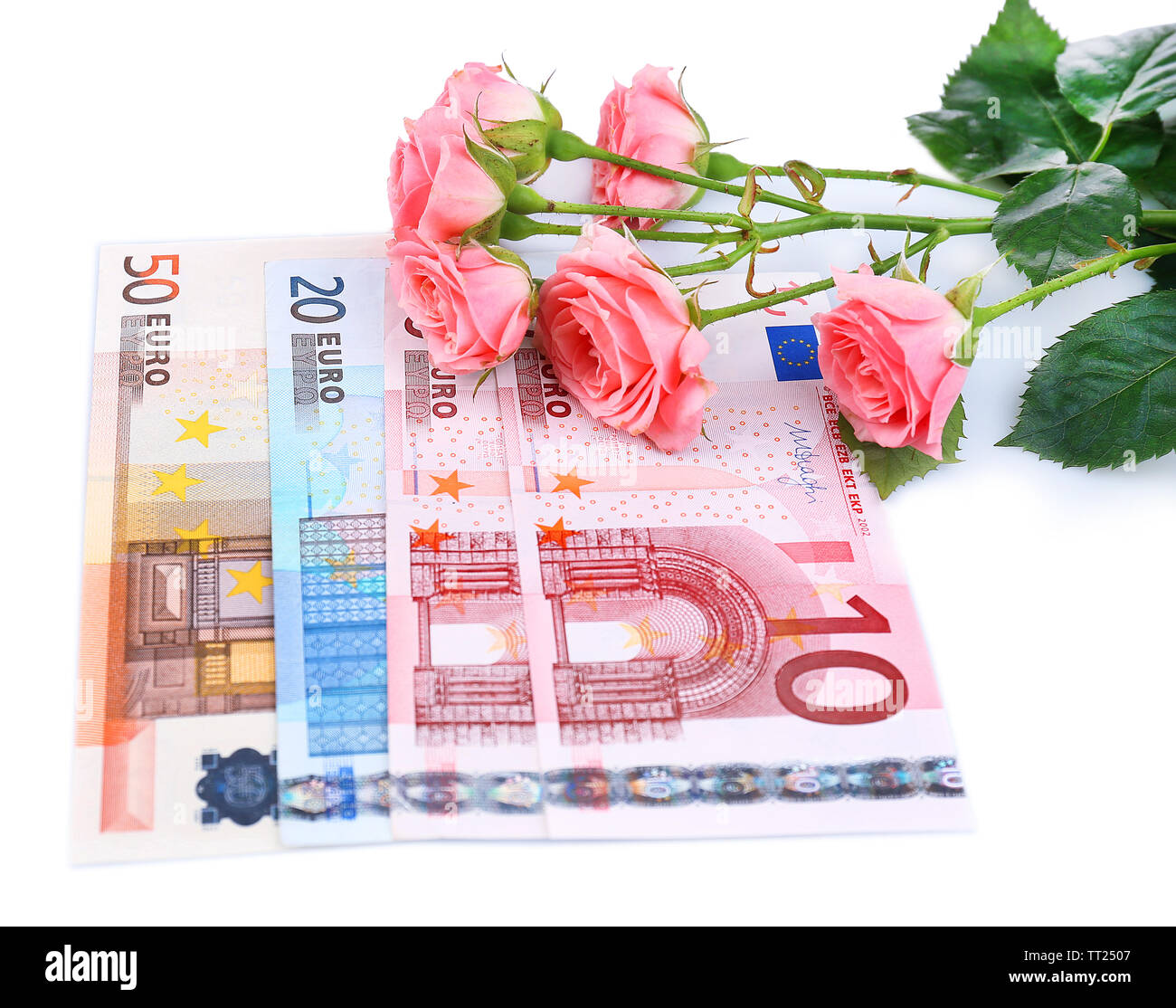 Beautiful roses and money, isolated on white Stock Photo - Alamy