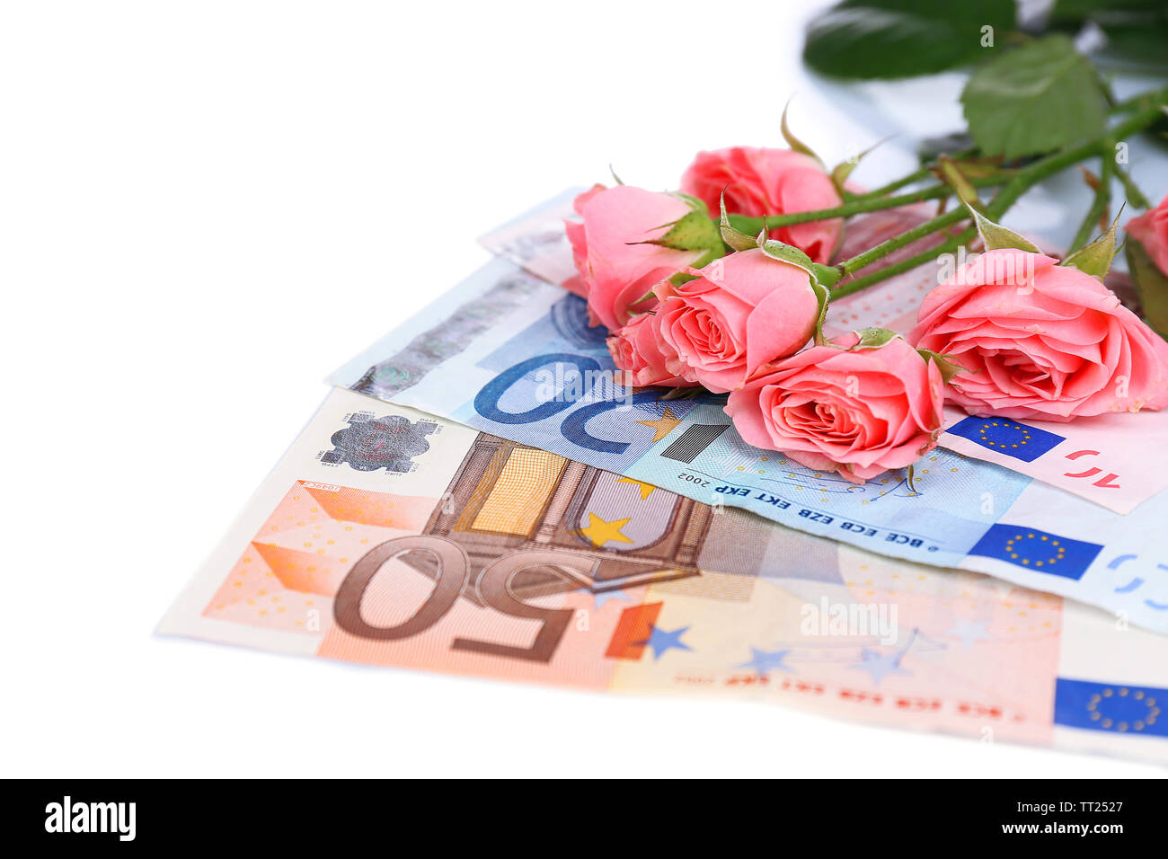 Beautiful roses and money, isolated on white Stock Photo - Alamy