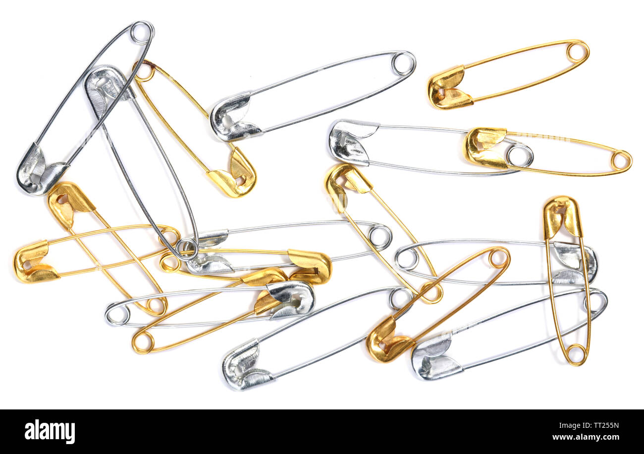 Safety pins isolated on white Stock Photo - Alamy