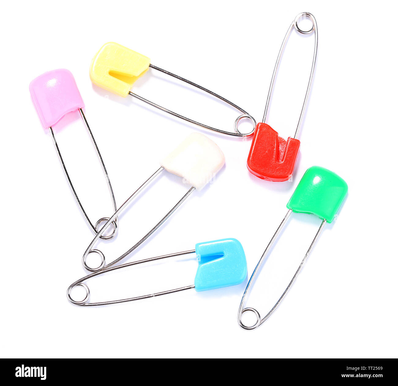 Multicolor safety pins isolated on white Stock Photo - Alamy