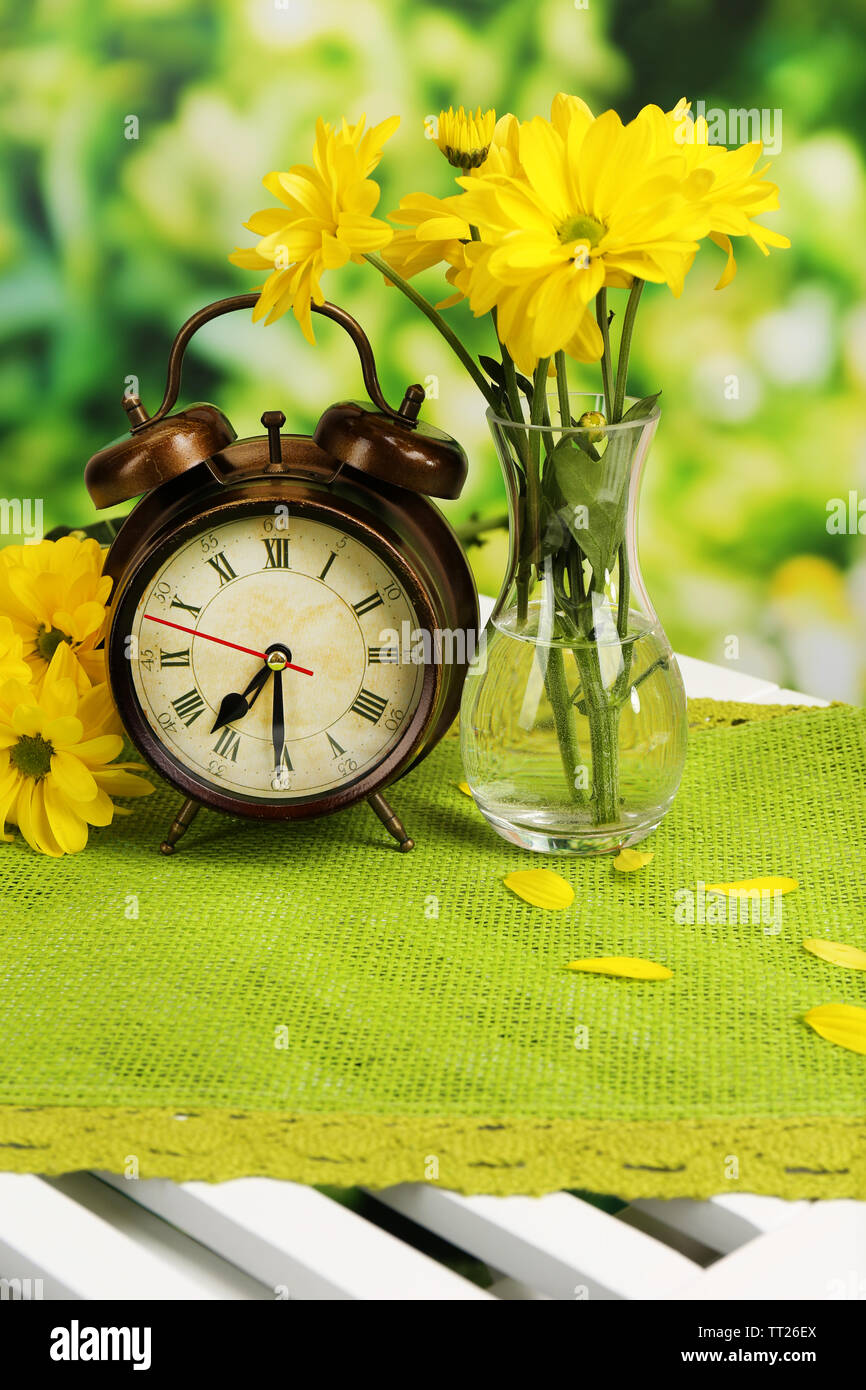 Digital alarm clock on table, on nature background Stock Photo - Alamy