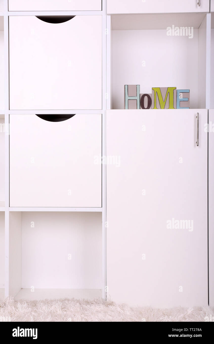 Shelves with decorative letter close up Stock Photo - Alamy