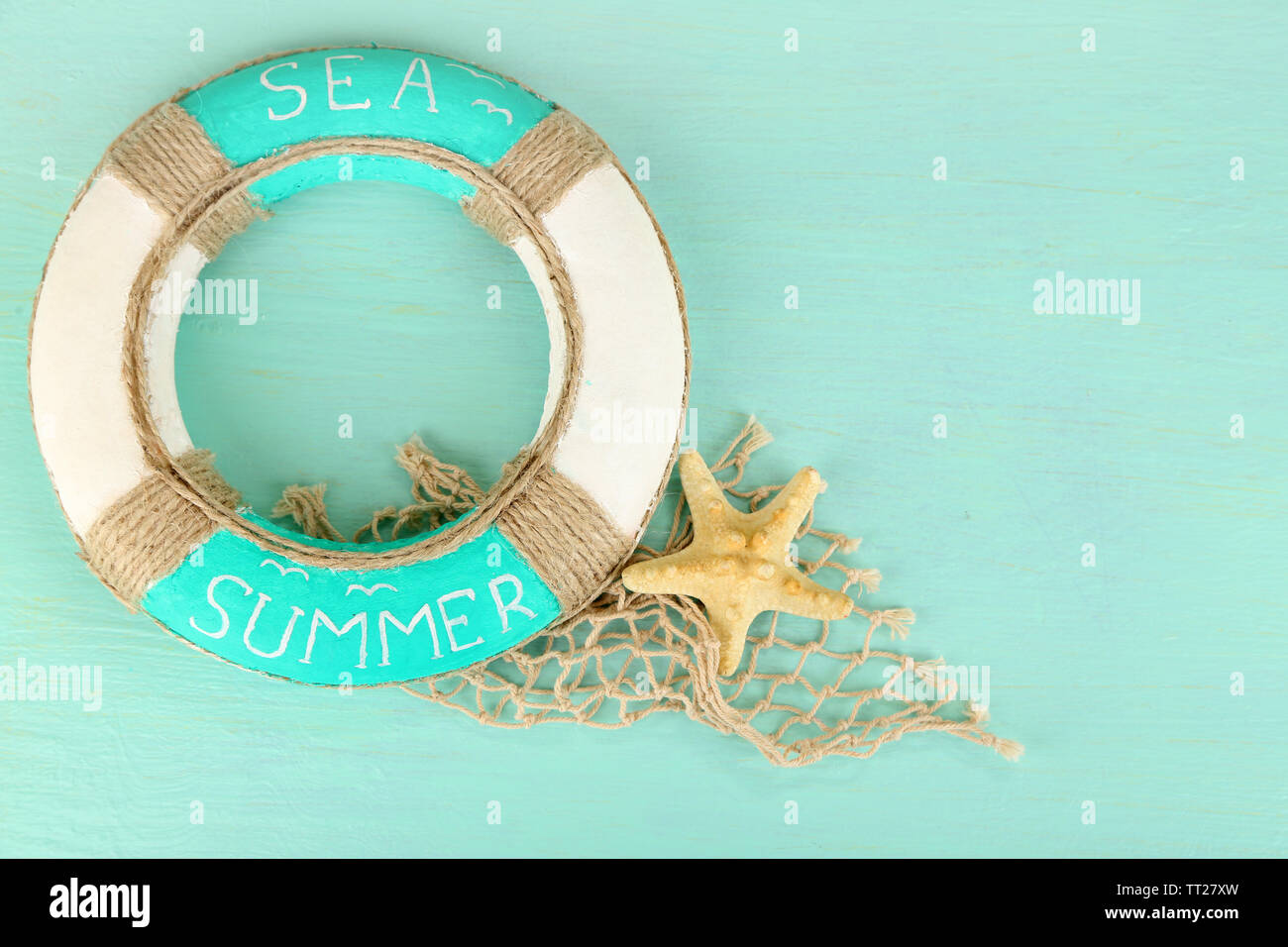 Lifebuoy on blue background Stock Photo - Alamy