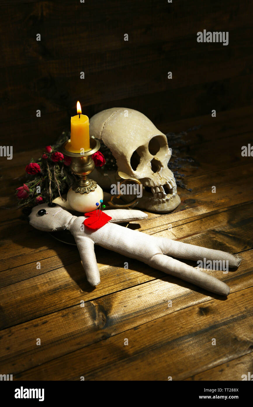Conceptual photo of love magic. Composition with skull, voodoo doll ...