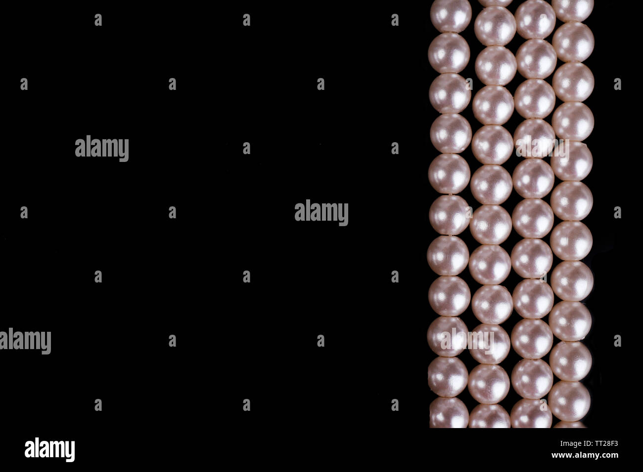 Beautiful pearls on black background Stock Photo - Alamy