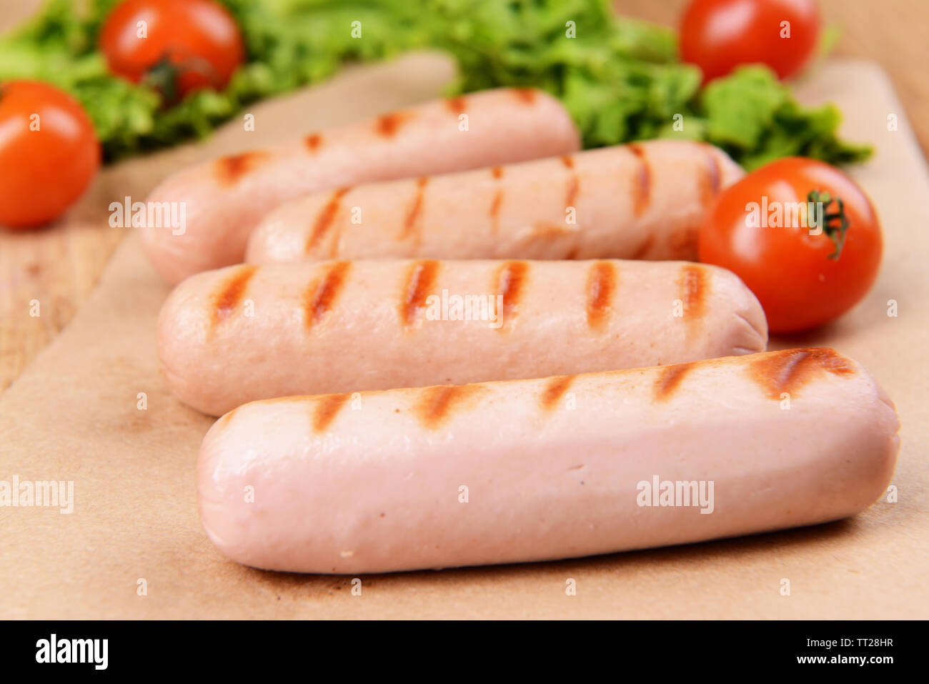 Grilled sausage on table close-up Stock Photo - Alamy