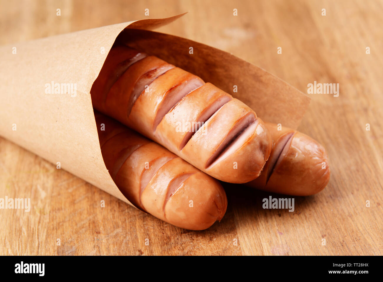 Grilled sausage on table close-up Stock Photo - Alamy