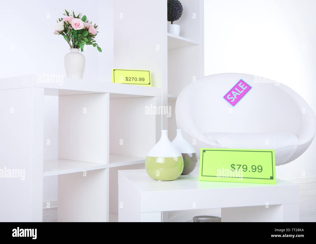 New white furniture with prices on light background Stock Photo - Alamy