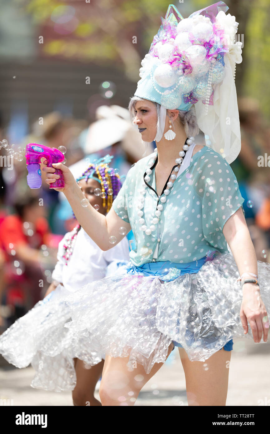 Cleveland, Ohio, USA - June 8, 2019: Parade the Circle, woman using a ...