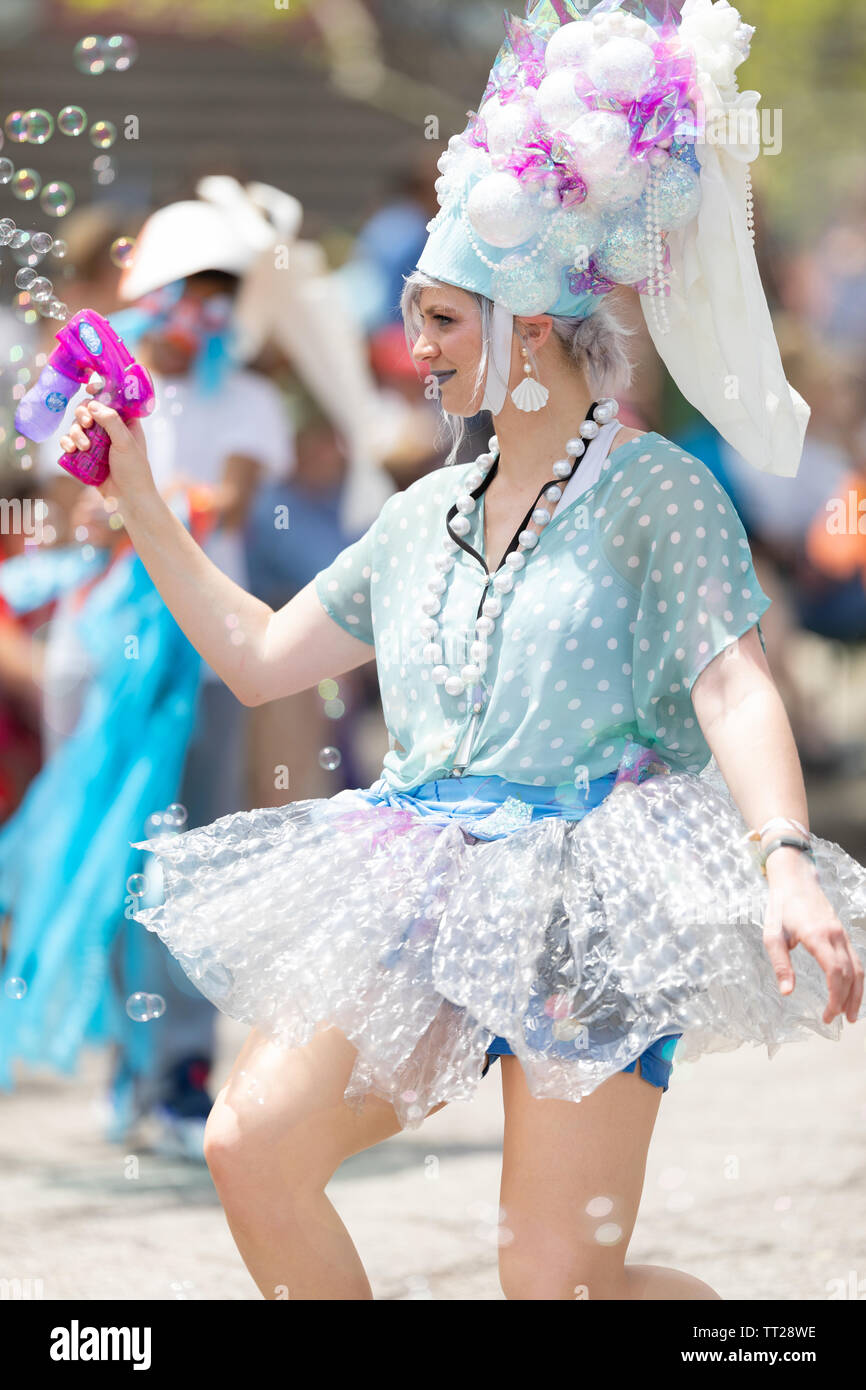 Cleveland, Ohio, USA - June 8, 2019: Parade the Circle, woman using a ...