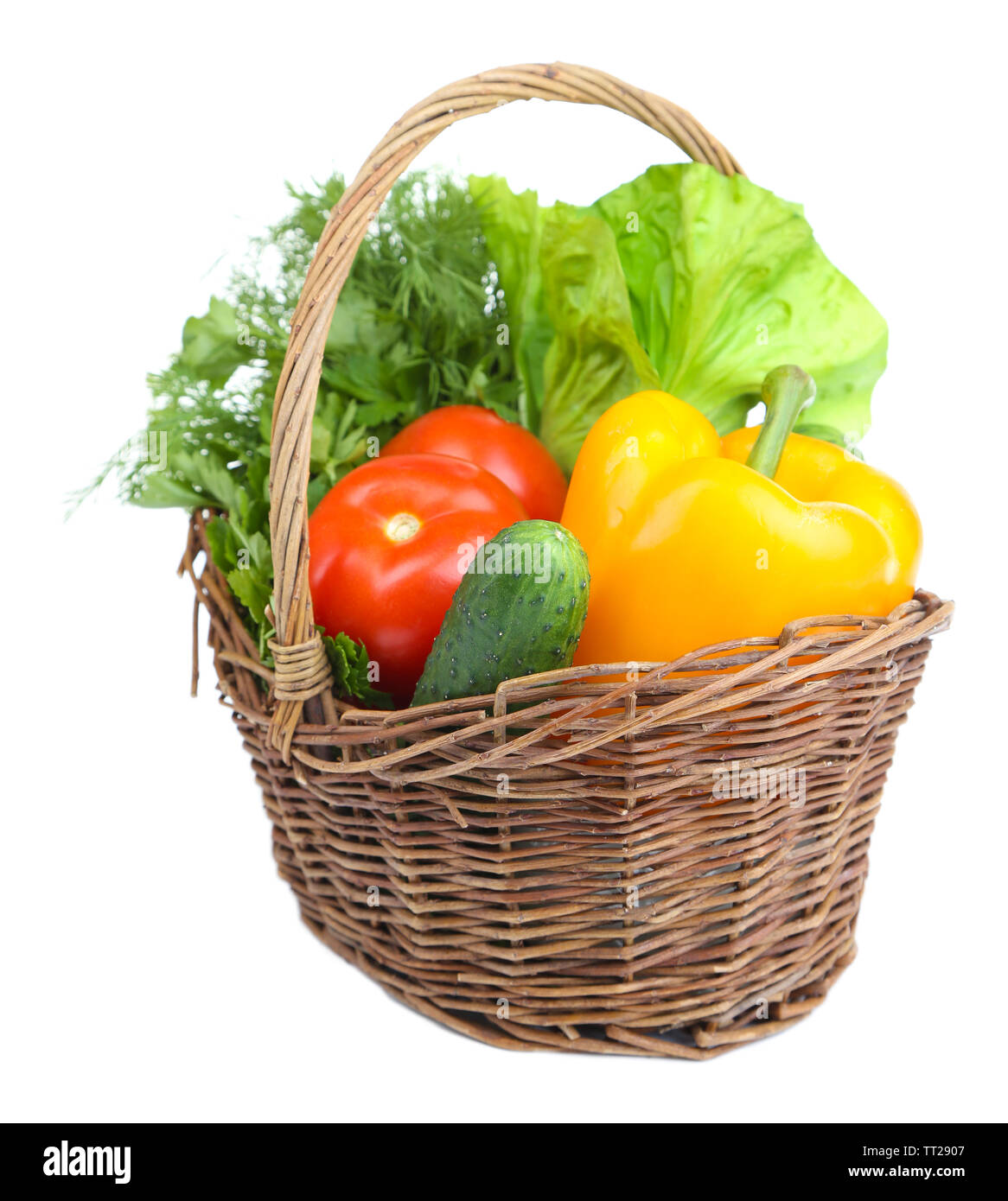 Composition with raw vegetables in wicker basket isolated on white ...
