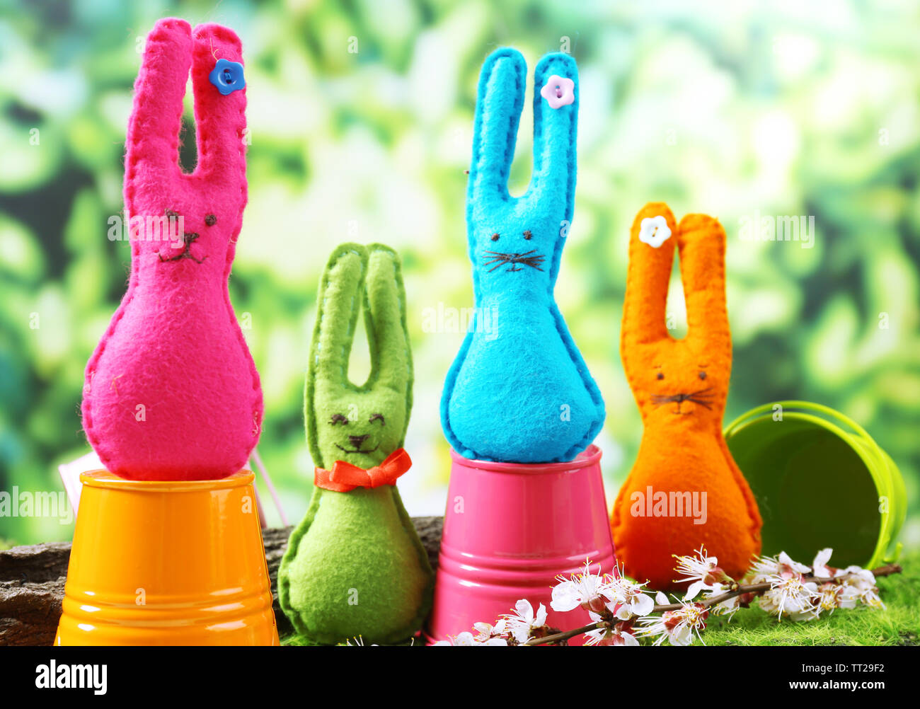 Funny handmade Easter rabbits on green grass Stock Photo - Alamy