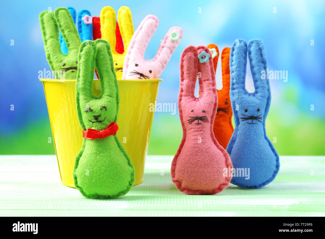 Funny handmade Easter rabbits on wooden table Stock Photo - Alamy