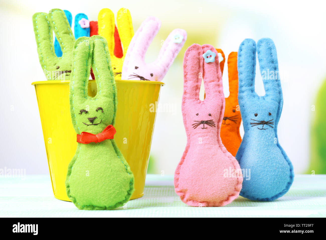 Funny handmade Easter rabbits on wooden table Stock Photo - Alamy