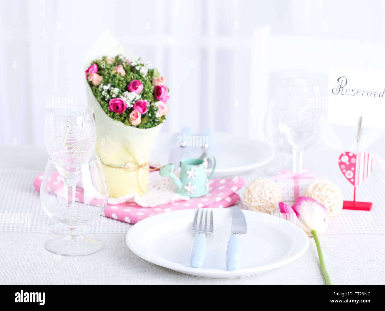 Beautiful spring table setting on light background Stock Photo - Alamy