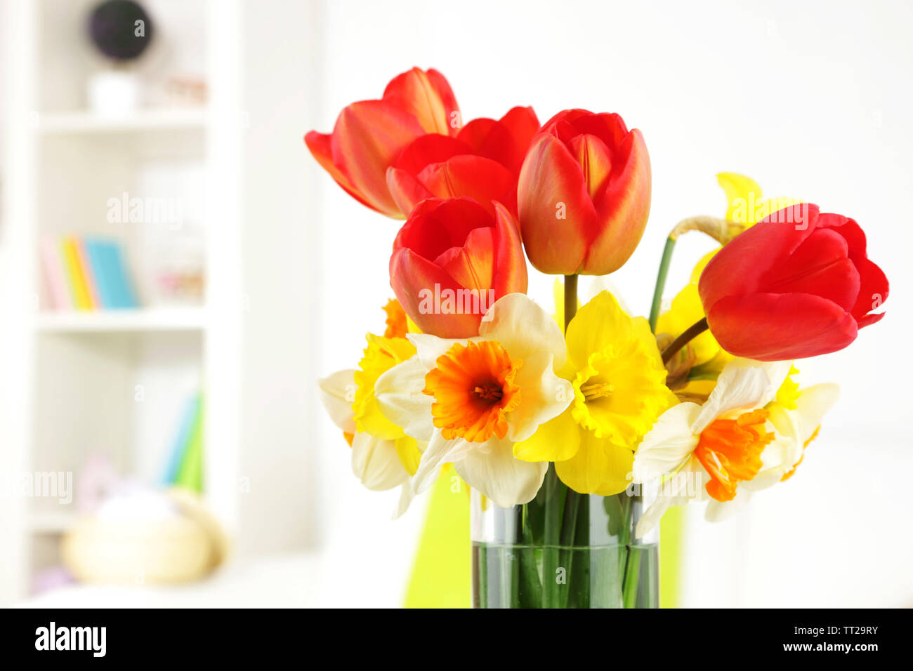 Beautiful spring flowers in vase on home interior background Stock ...