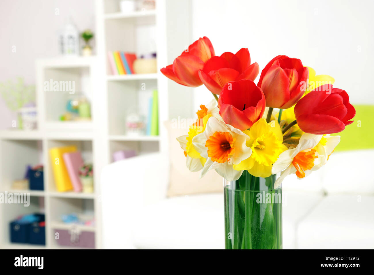 Beautiful spring flowers in vase on home interior background Stock ...