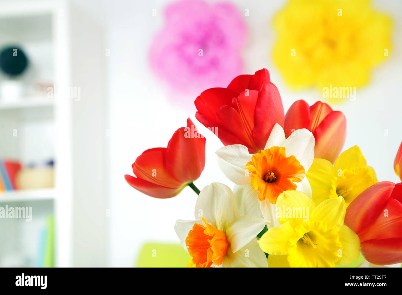 Beautiful spring flowers in vase on home interior background Stock ...