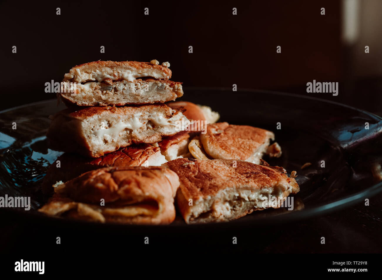 Close up of Malaysian well known food "Roti John" on a dark background ...