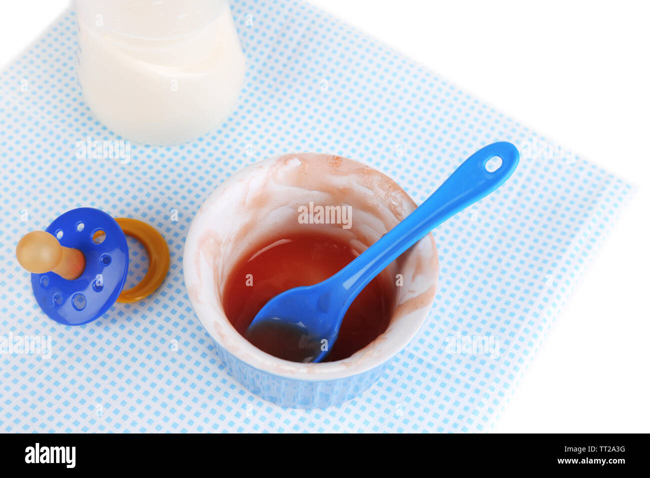 Baby food and milk on napkin close up Stock Photo - Alamy