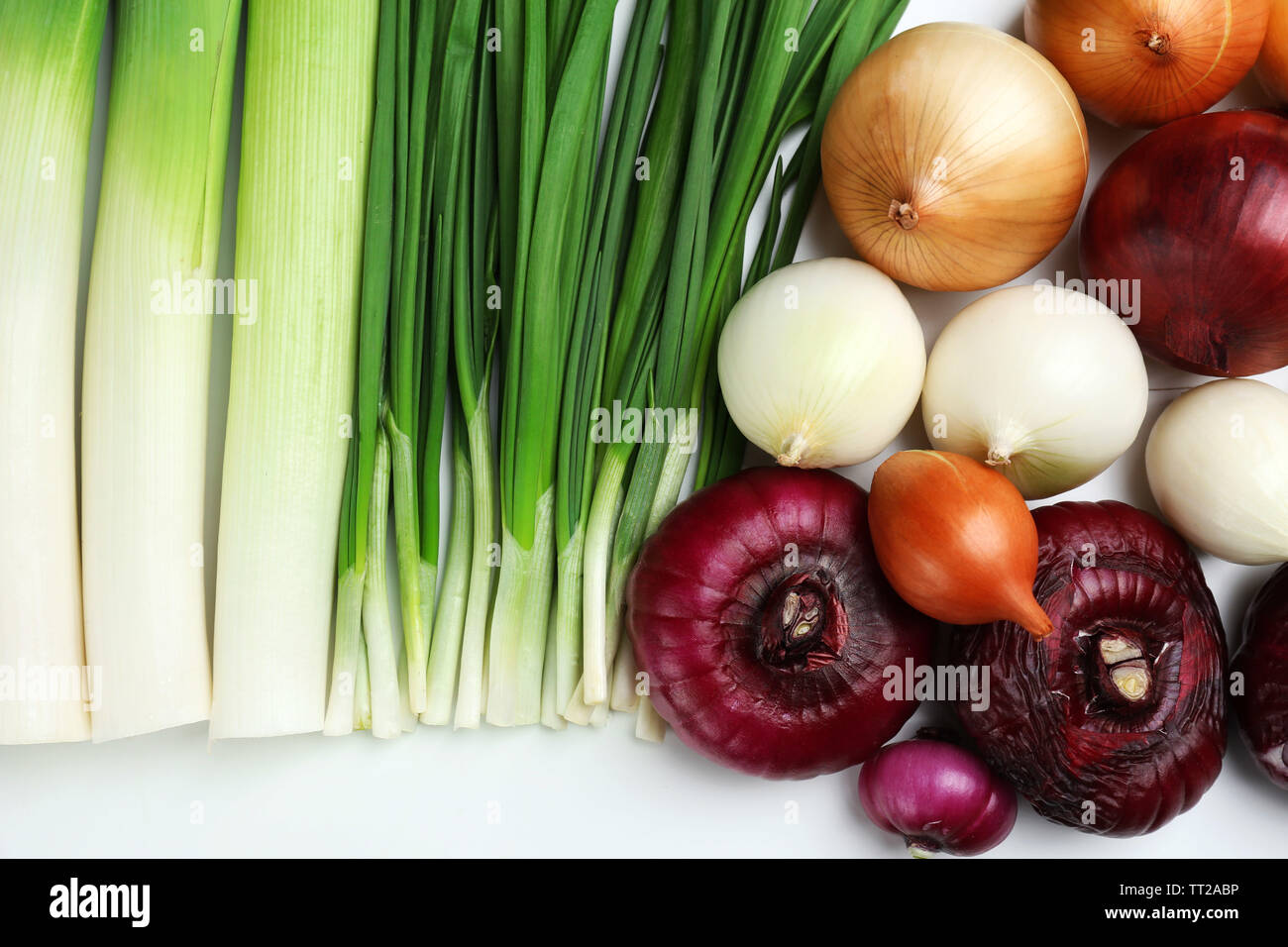 Different raw onion, isolated on white Stock Photo - Alamy