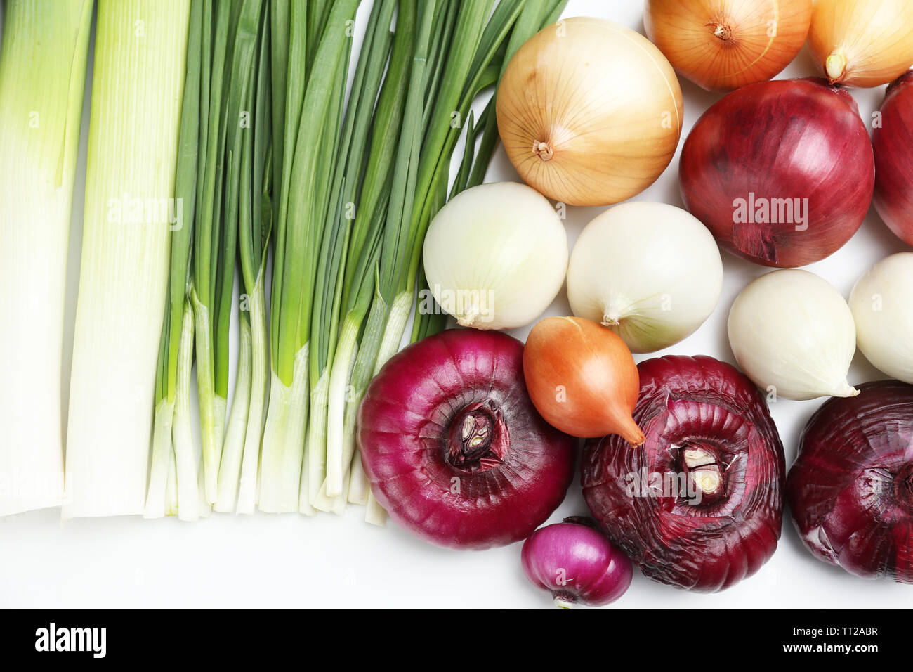 Different raw onion, isolated on white Stock Photo - Alamy