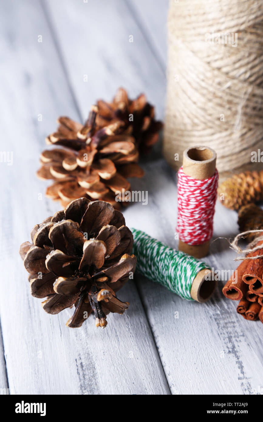 Composition with natural bump, thread, cinnamon sticks on wooden ...