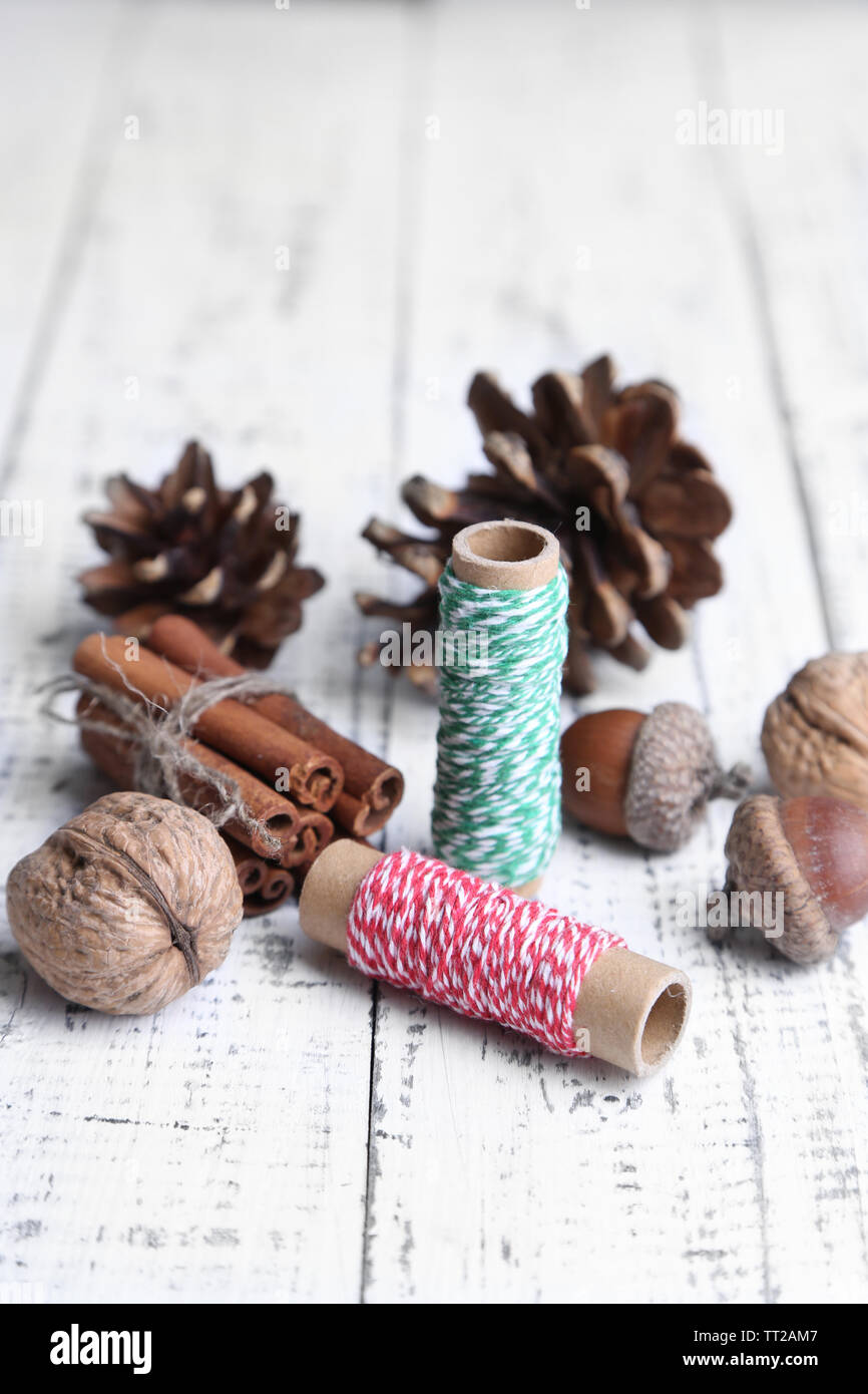 Composition with natural bump, thread, cinnamon sticks on wooden ...