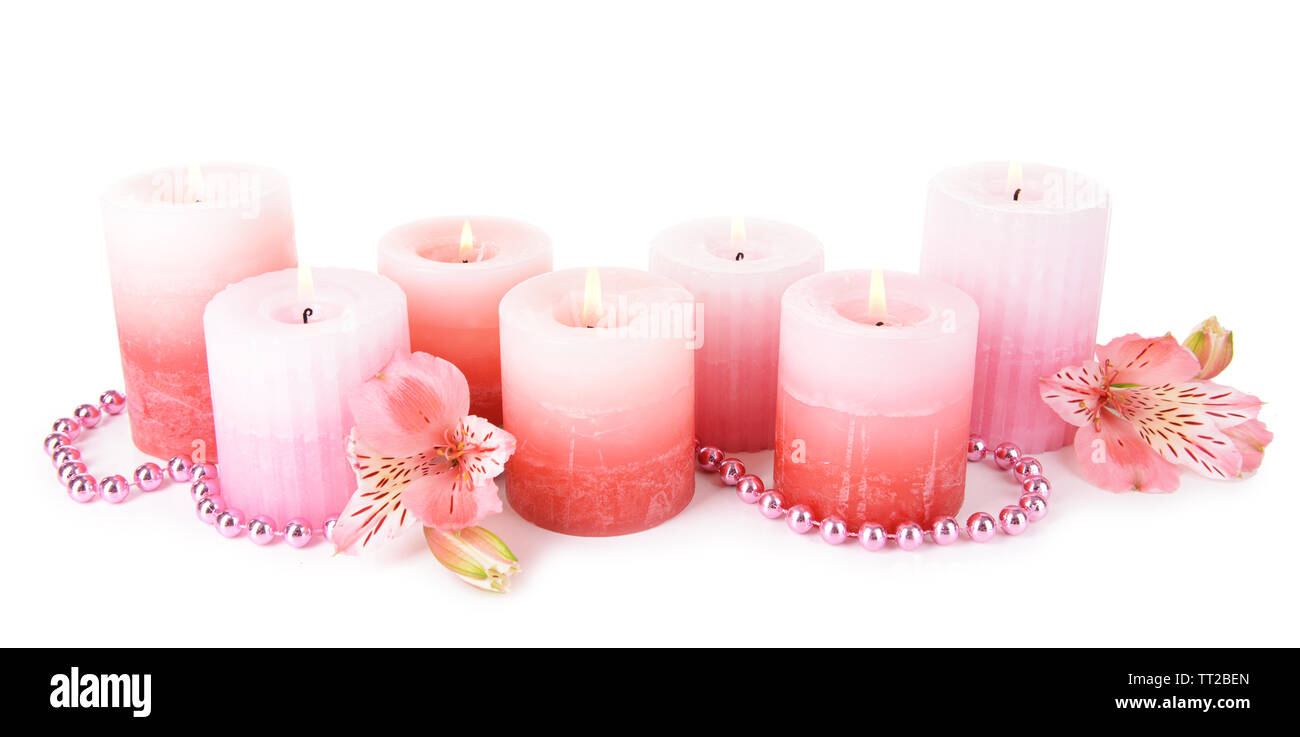 Beautiful candles with flowers isolated on white Stock Photo - Alamy