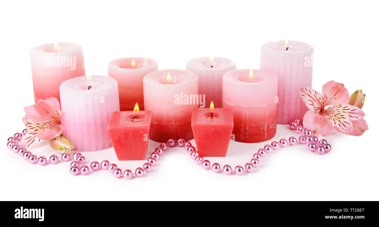Beautiful candles with flowers isolated on white Stock Photo - Alamy