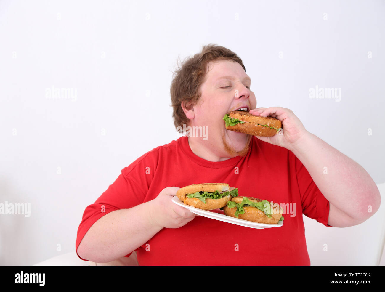 Fat Man Eating Chili Dogs