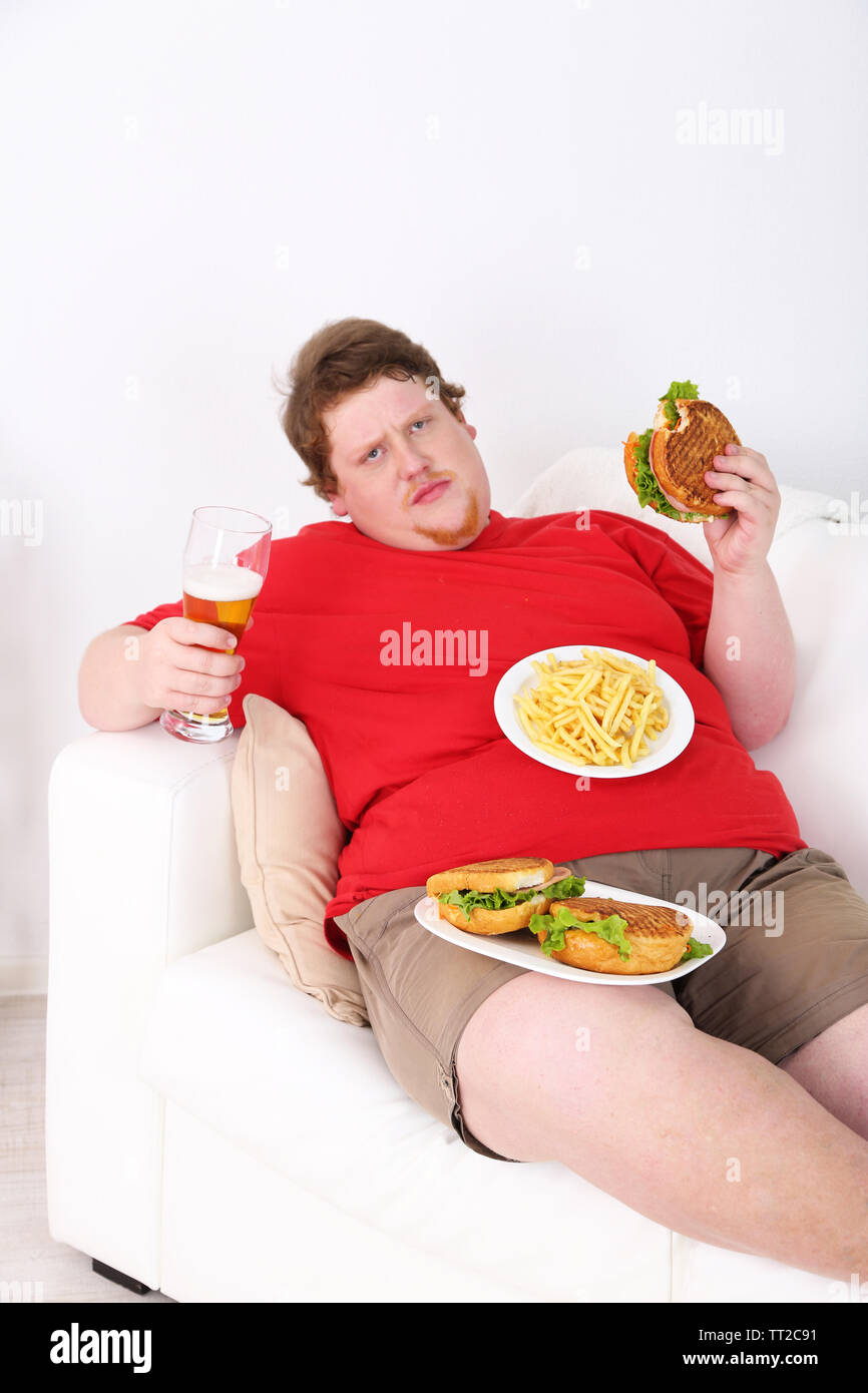 Fat man eating hi-res stock photography and images - Alamy
