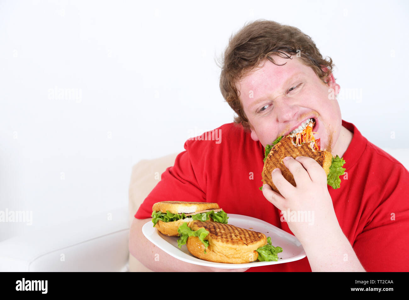 Fat man eating hi-res stock photography and images - Alamy