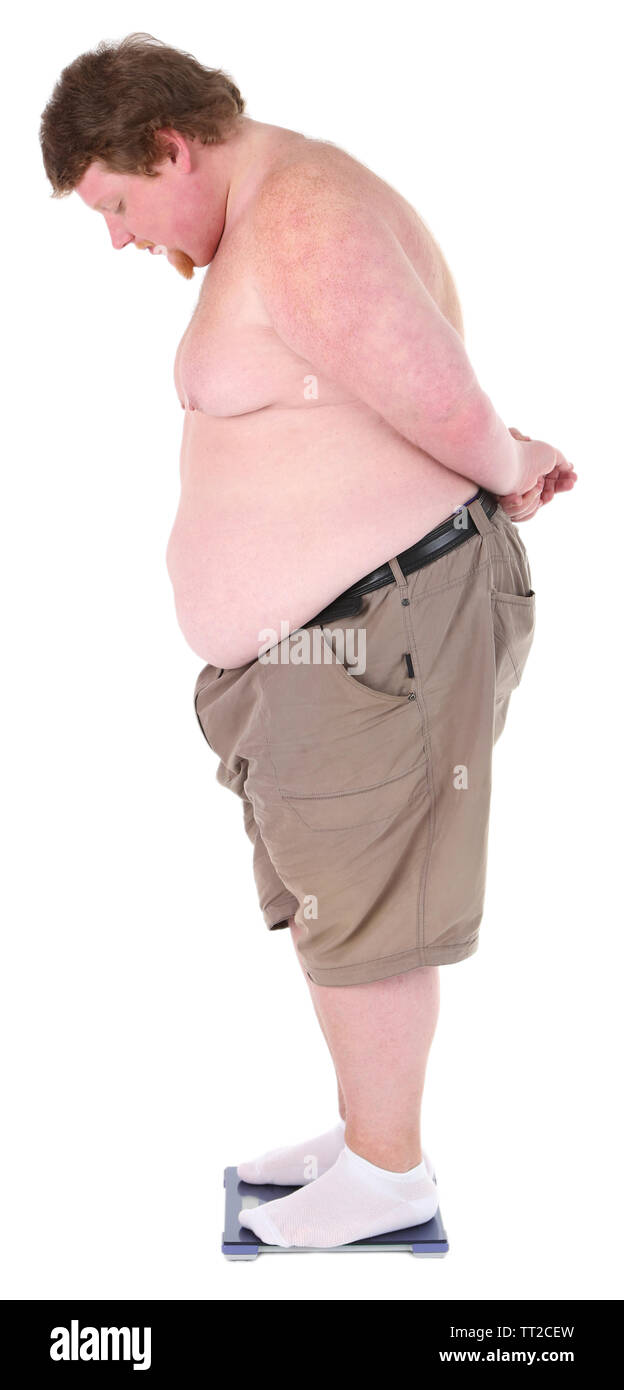 Fat man standing on electronic scales . Conceptual photo of weight loss ...