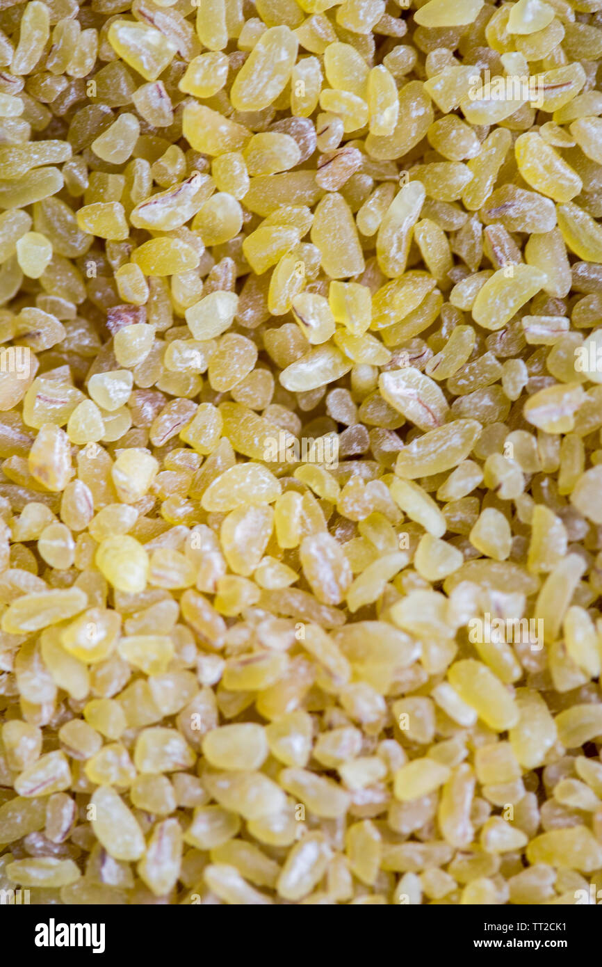 cracked wheat rice pattern texture uncooked Stock Photo - Alamy