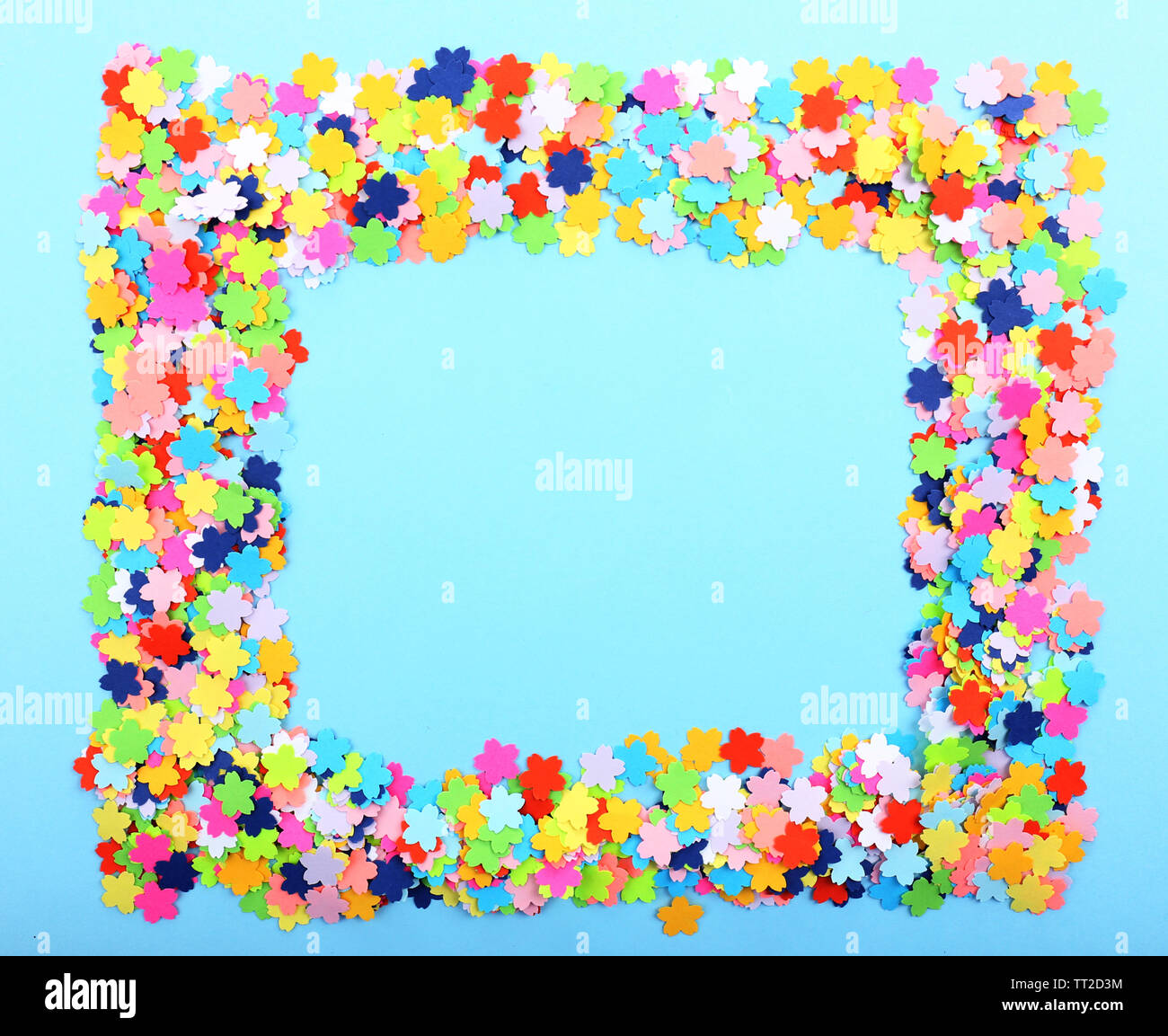 Confetti frame on blue background Stock Photo - Alamy