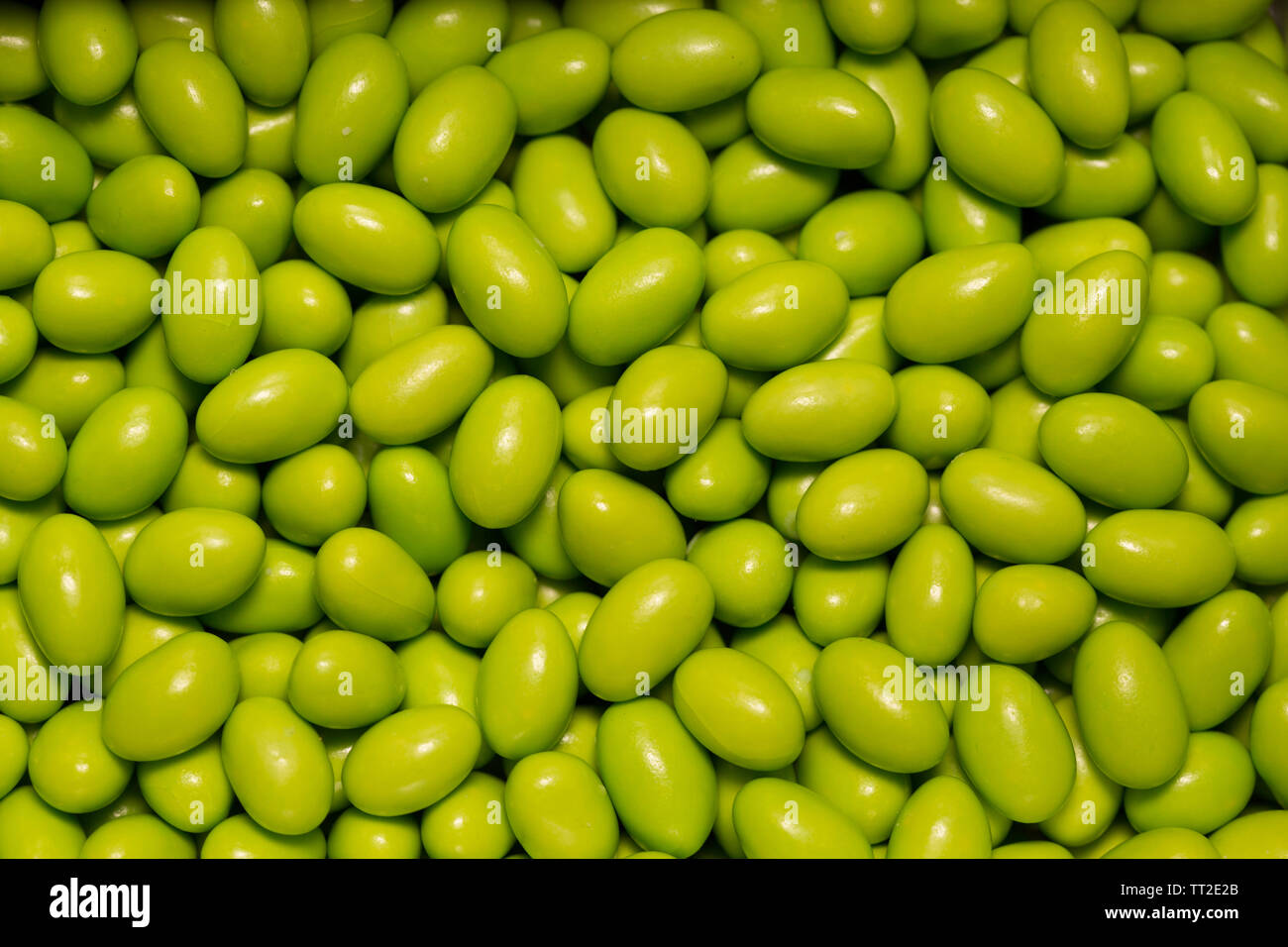neon green candies sugar coated chocolates Stock Photo - Alamy